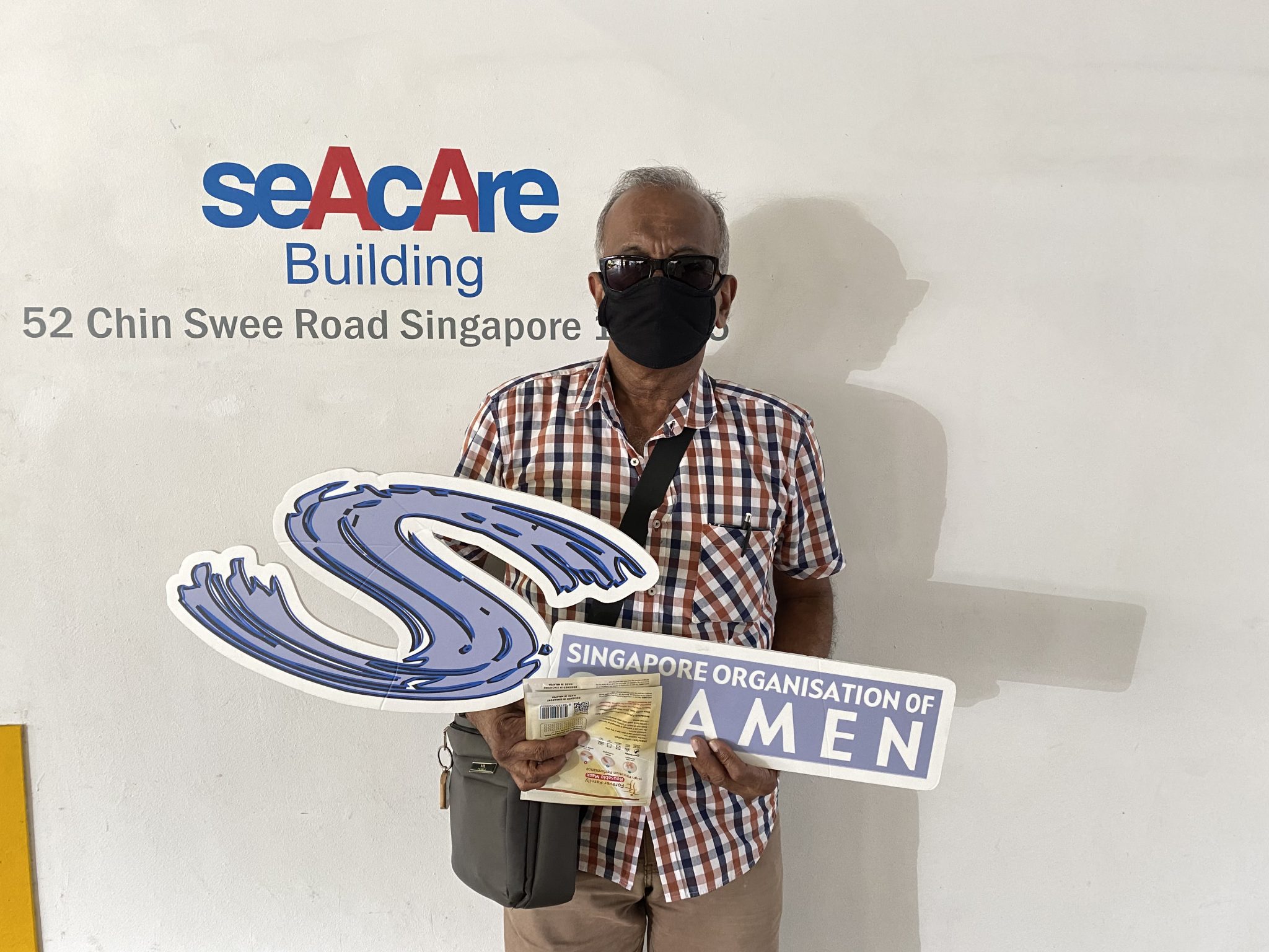 SOS & Seacare Distribute Reusable Face Masks for Members